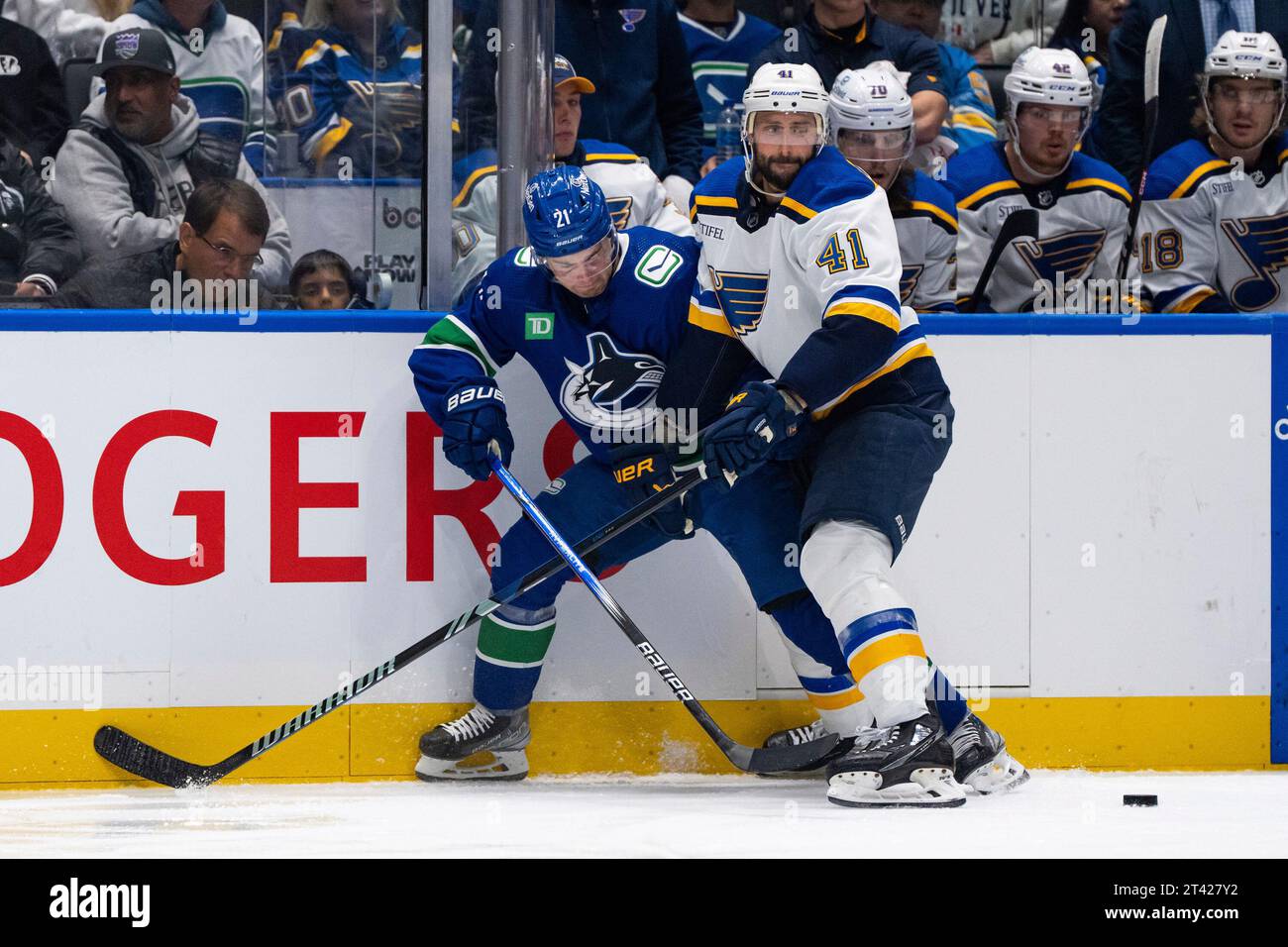 Vancouver Canucks' Nils Hoglander (21) and St. Louis Blues' Robert ...