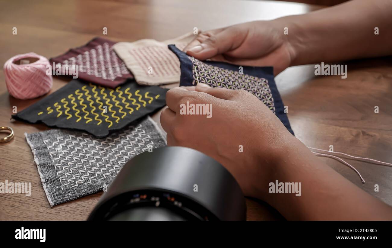 Sewing Tutorial Delight: Women's Hands Stitching on Dark Fabric Stock ...