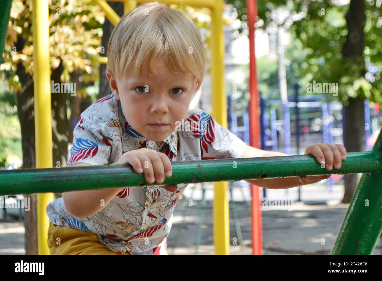 Little children run around and play in the playground. Game center for ...