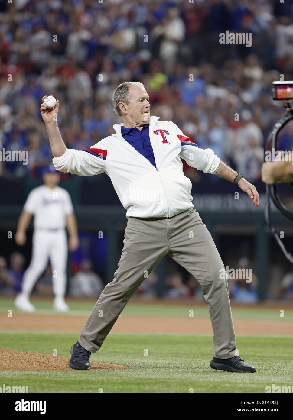 Former U.S. President George W. Bush throws the ceremonial first pitch ...