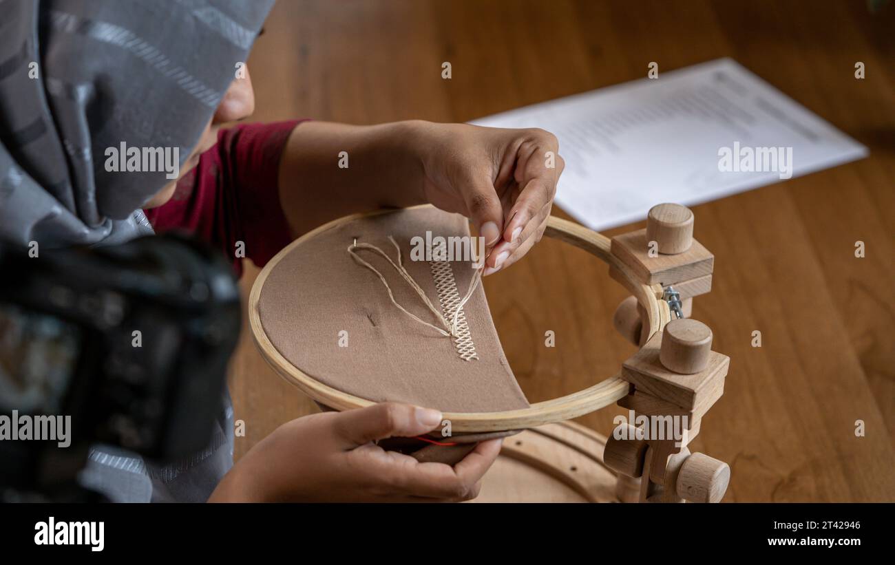 Sewing Tutorial Delight: Women's Hands Stitching on Dark Fabric Stock ...