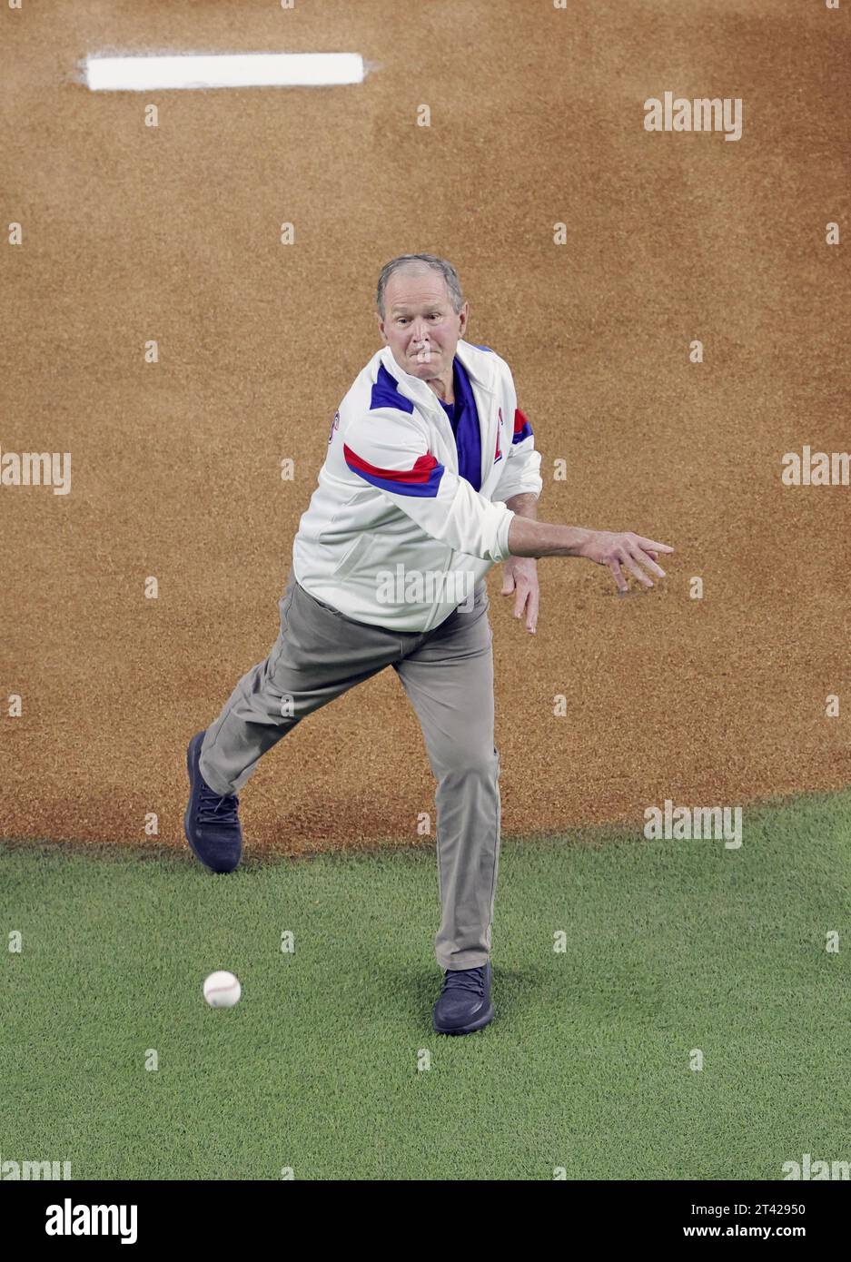 Former U.S. President George W. Bush throws the ceremonial first pitch ...