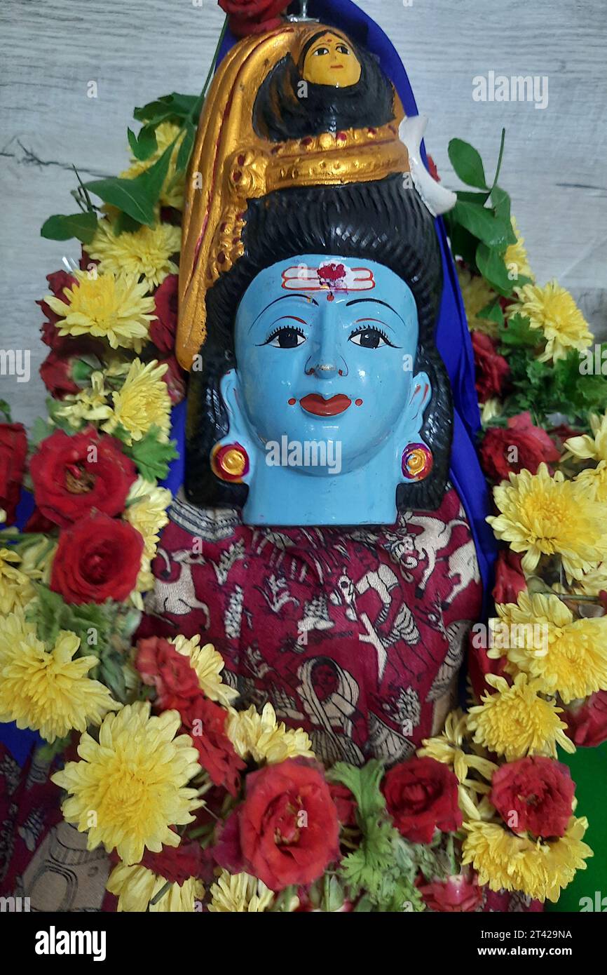 View of face of shiva decorated with flower garlands Stock Photo - Alamy