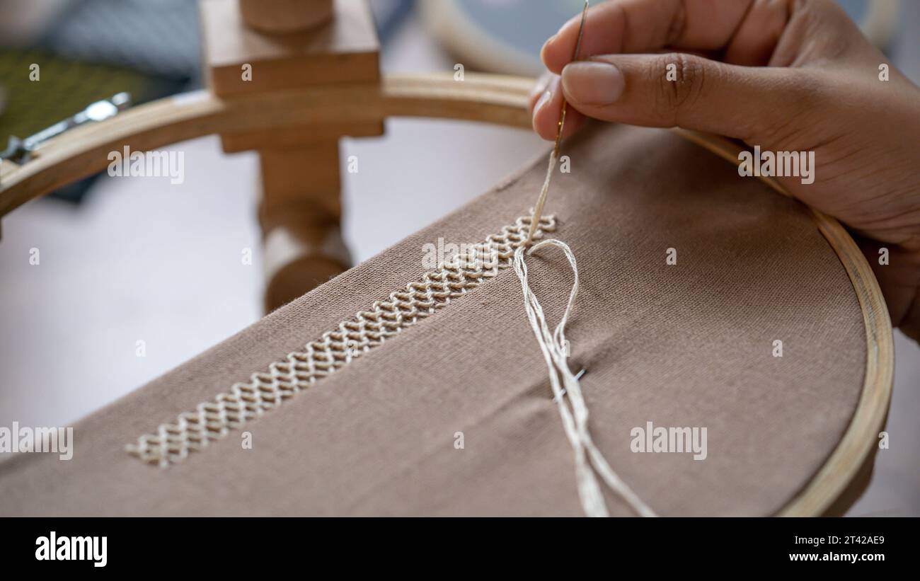 Artistry Unveiled: Women's Hand Stitching Border Pattern on Linen ...