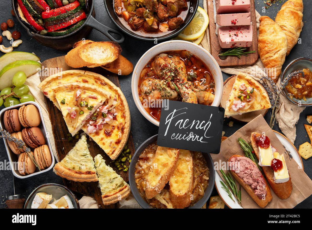 French food assortment on dark background. Traditional cuisine concept ...