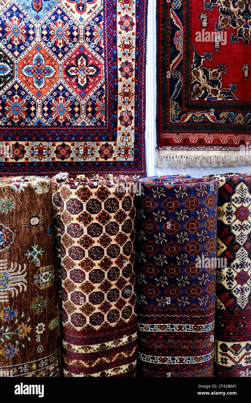 Carpet being rolled and displayed at a carpet exhibition in pune ...
