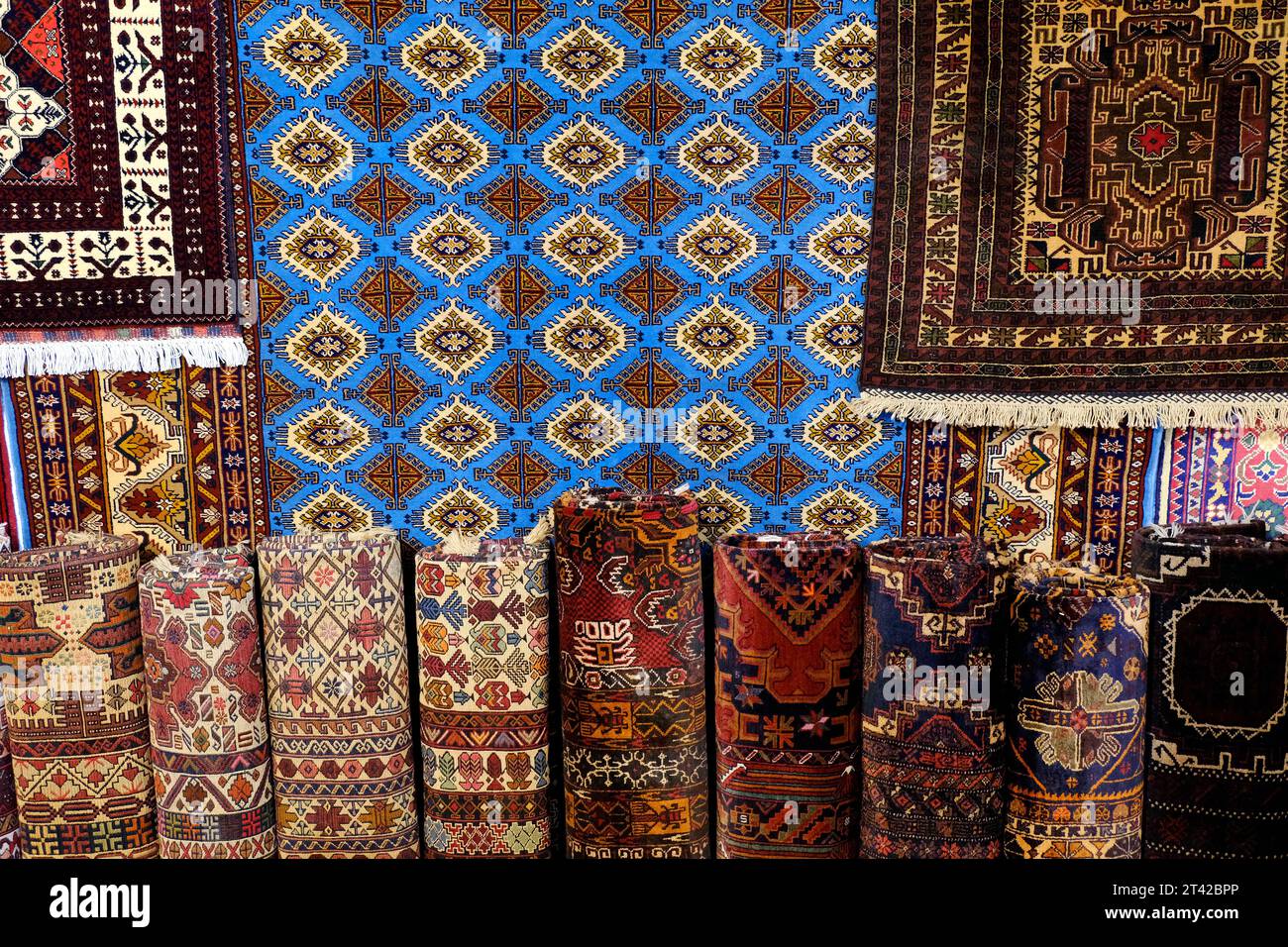 Carpet being rolled and displayed at a carpet exhibition in pune ...