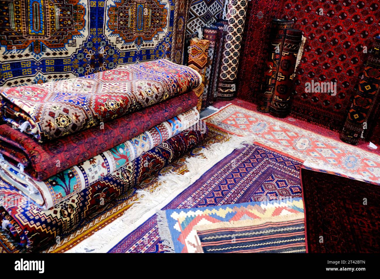 Carpet being rolled and displayed at a carpet exhibition in pune, Kashmir Floral design Silk ...