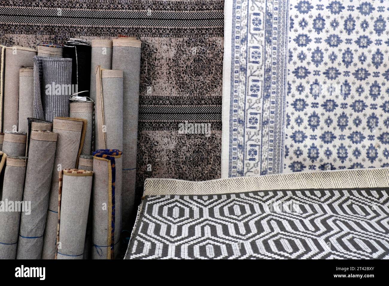 Carpet being rolled and displayed at a carpet exhibition in pune ...