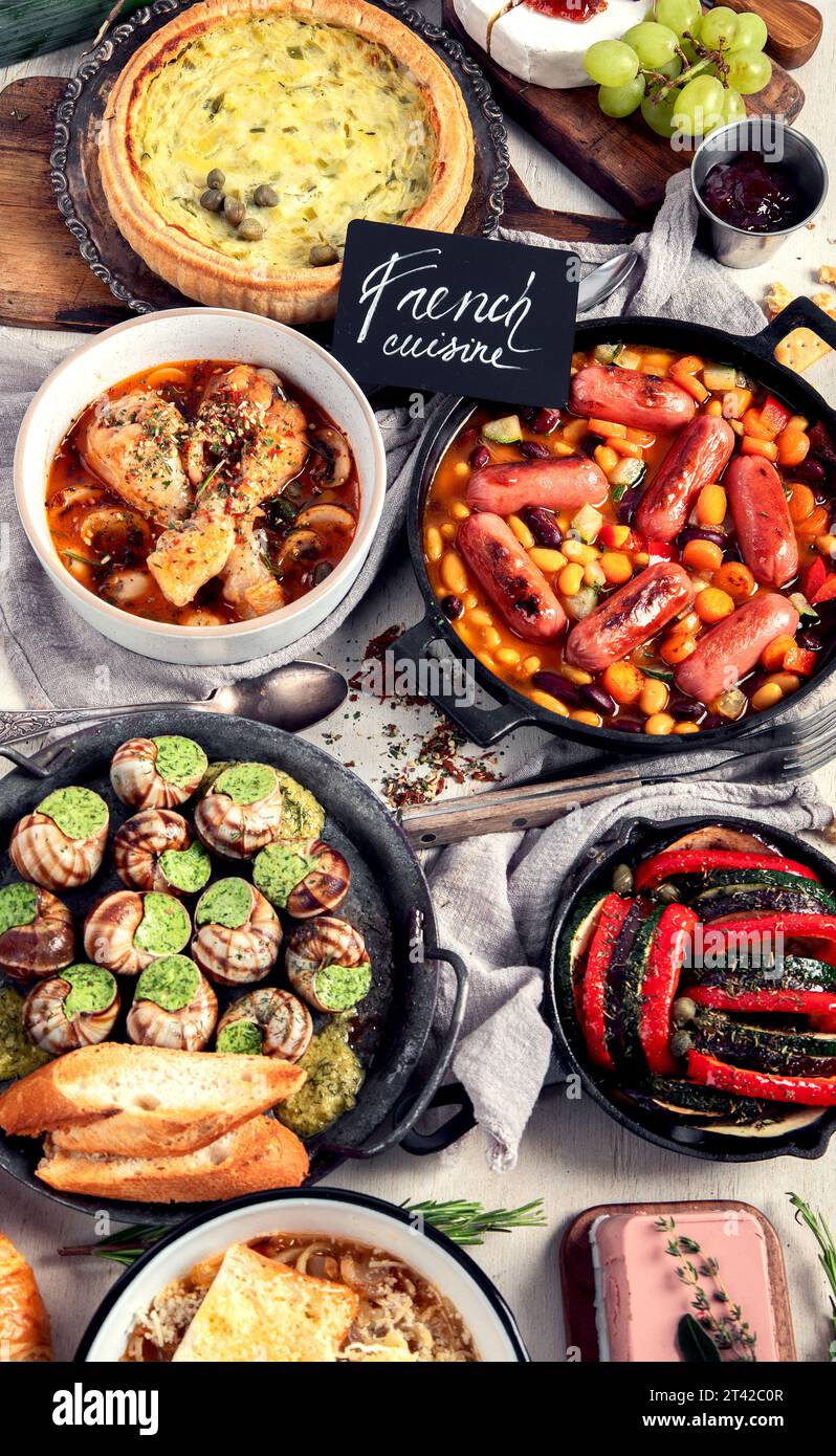 French food assortment on dark background. Traditional cuisine concept ...