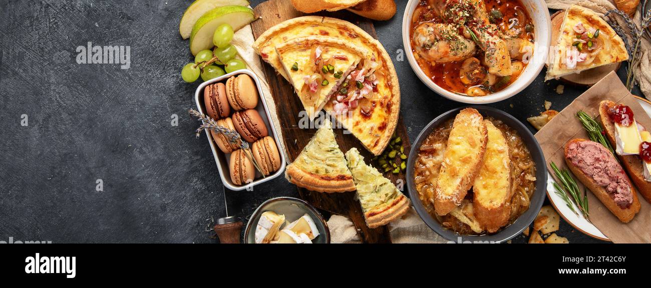 French food assortment on dark background. Traditional cuisine concept ...
