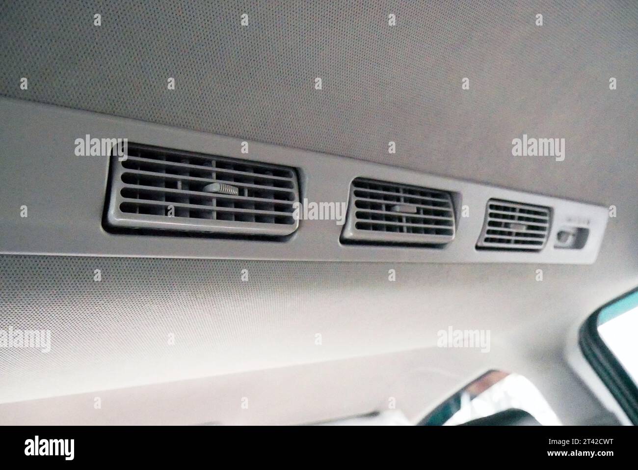 Three AC steam ducts in the car. Cold water Stock Photo - Alamy