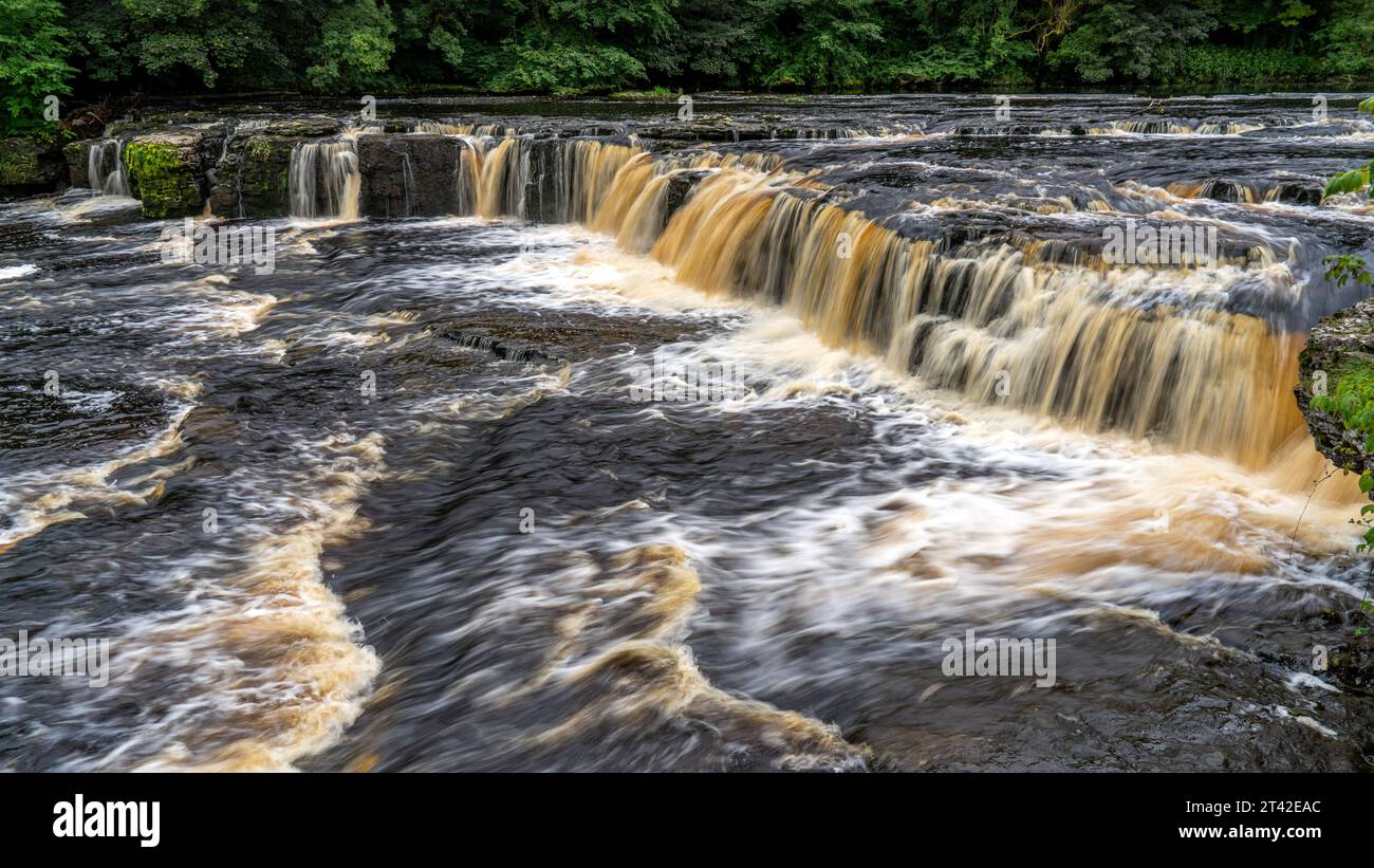 A scenic waterfall featuring two large cascading streams of water on ...