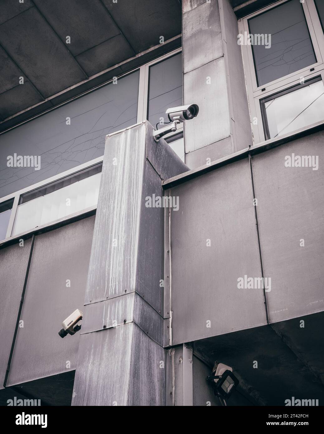 A metallic structure with multiple CCTV cameras attached to its side ...