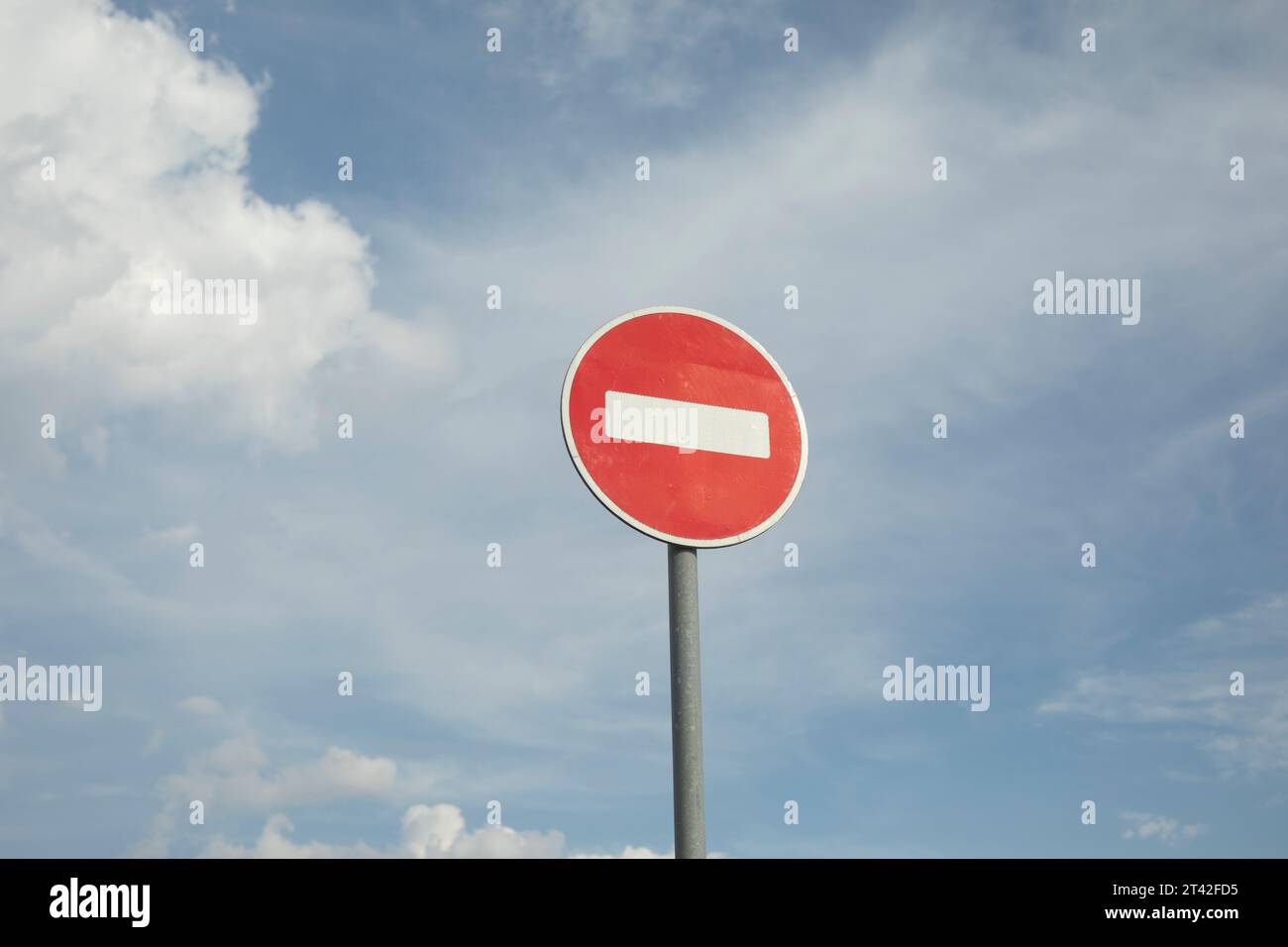 Stop sign on sky background. Road sign prohibiting traffic. Red circle ...