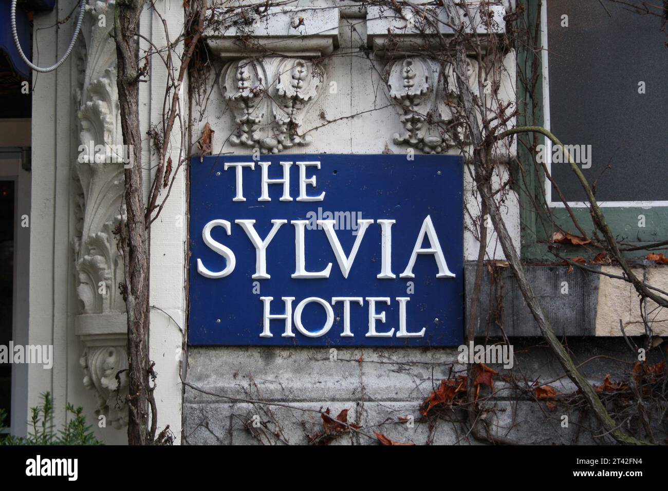 A close-up shot of a sign on the outside of a building, displaying the ...