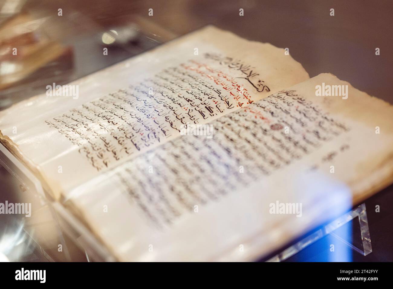 A closeup of Ancient Christian Bible, written in Arabic with a blurry ...