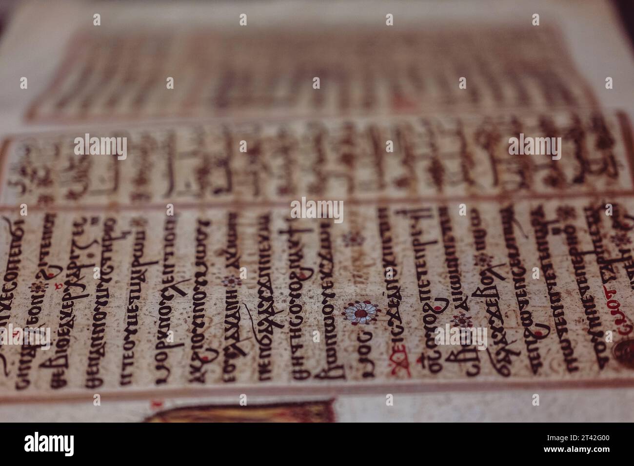 A closeup of Ancient Christian Bible, written in Arabic with a blurry ...
