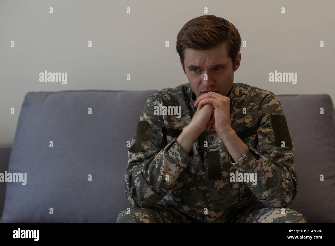 Thoughtful young handsome soldier in military uniform Stock Photo - Alamy