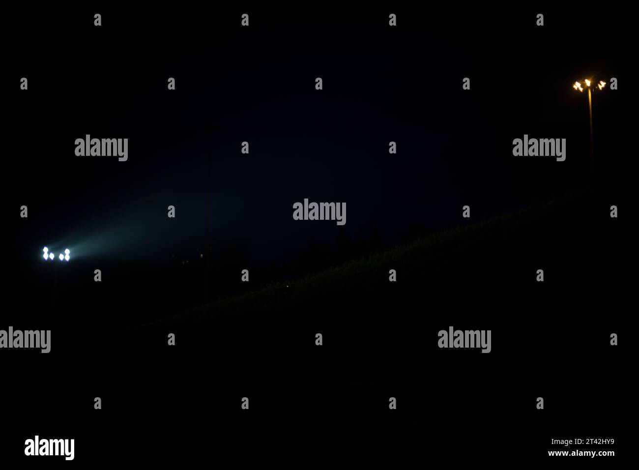 Two light sources in dark. Lamps on black background. Miscellaneous ...