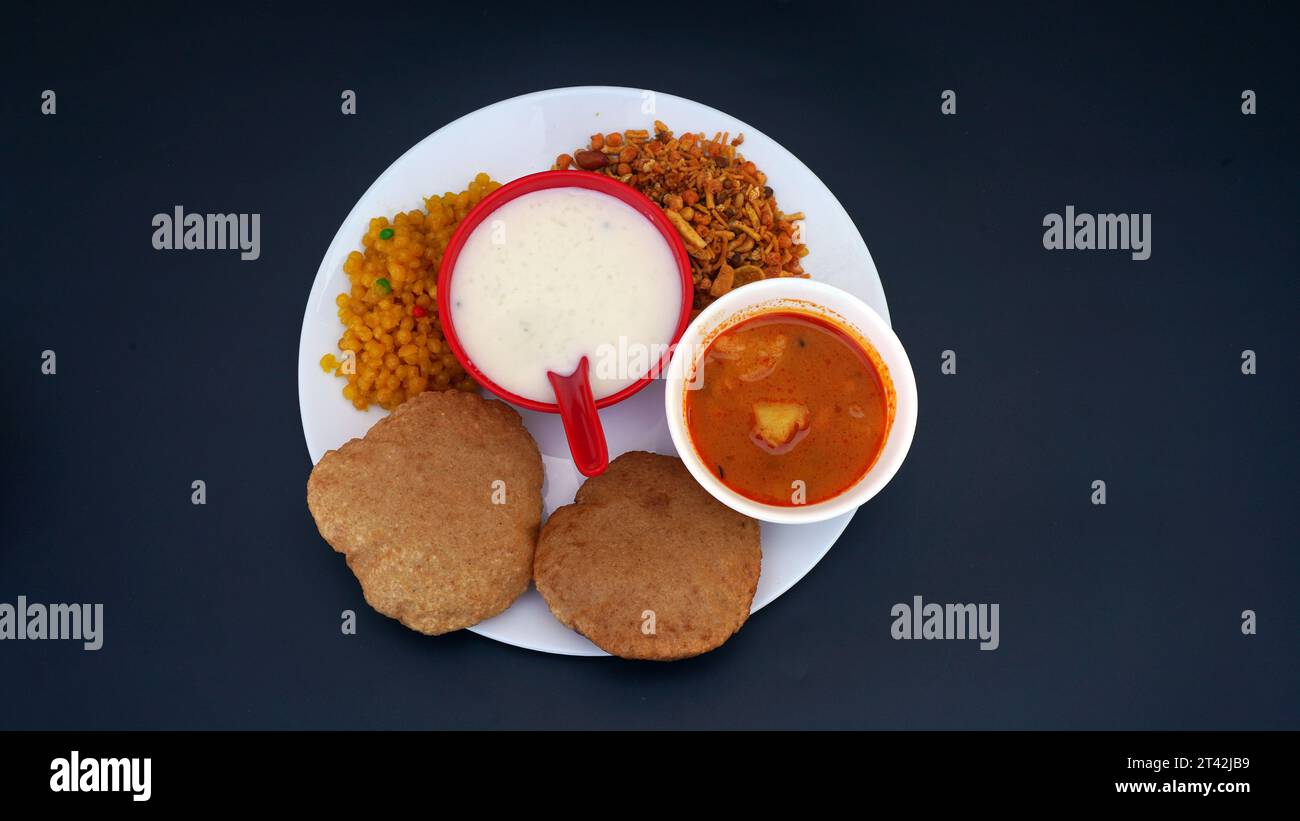 Indian food - Puri Bhaji and kheer. North Indian semi dry Potato Spicy ...