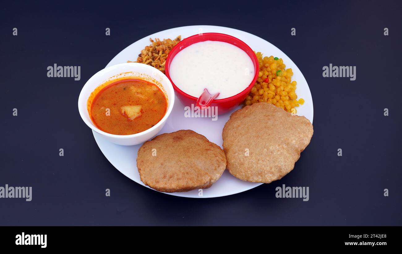 Indian food - Puri Bhaji and kheer. North Indian semi dry Potato Spicy ...