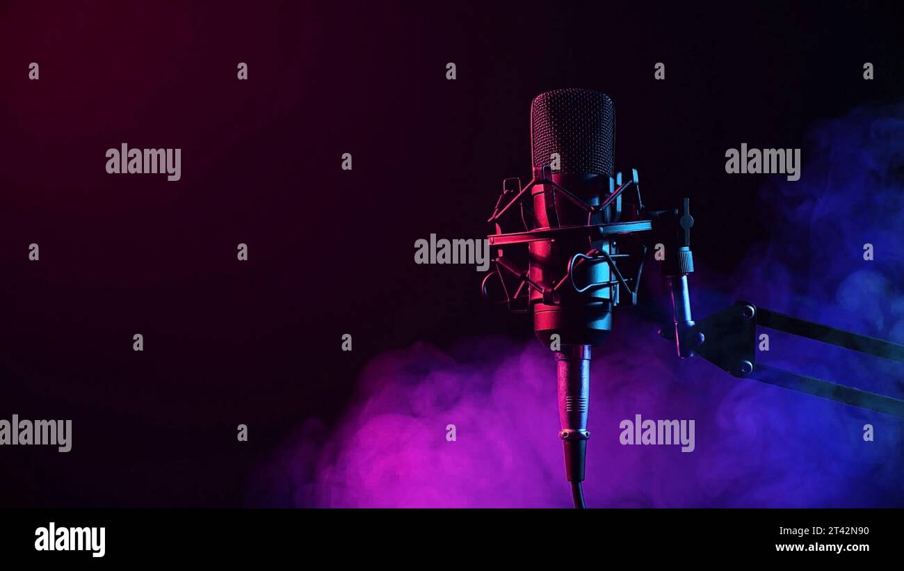 Professional microphone in pink smoke on a black background Stock Photo ...
