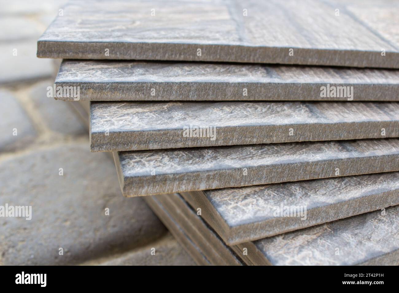sale of ceramic tiles close-up, several tiles laid on a heap Stock ...