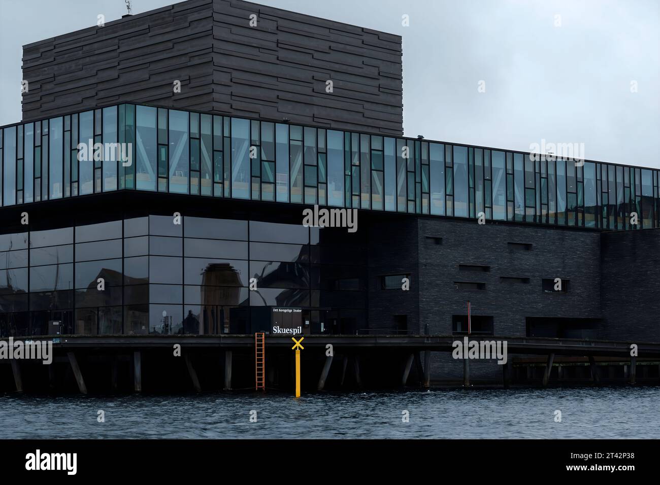 This grand building features large windows along its side, creating an ...