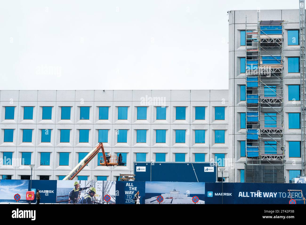 Construction workers stand on scaffolding hi-res stock photography and ...