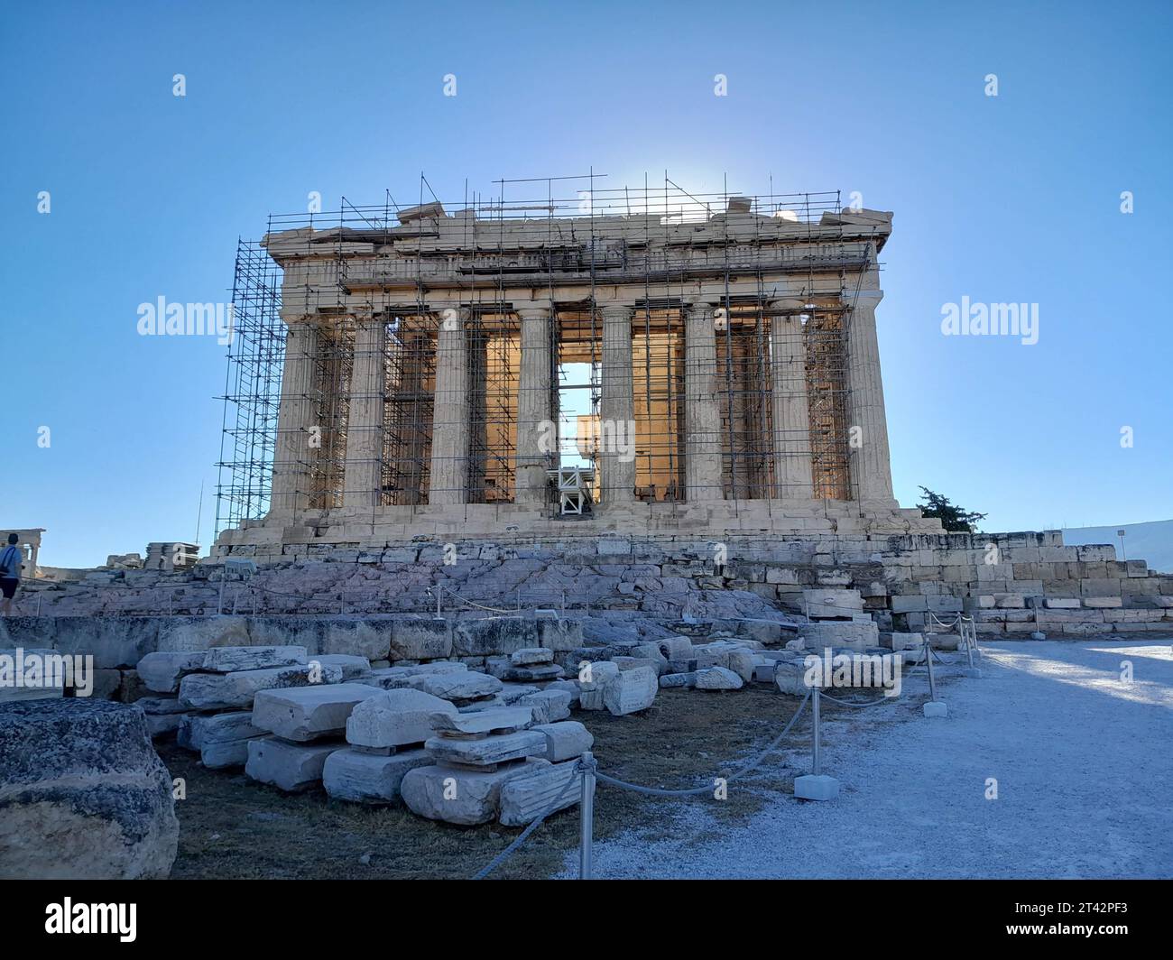 An ancient temple structure is seen surrounded by metal scaffolding ...