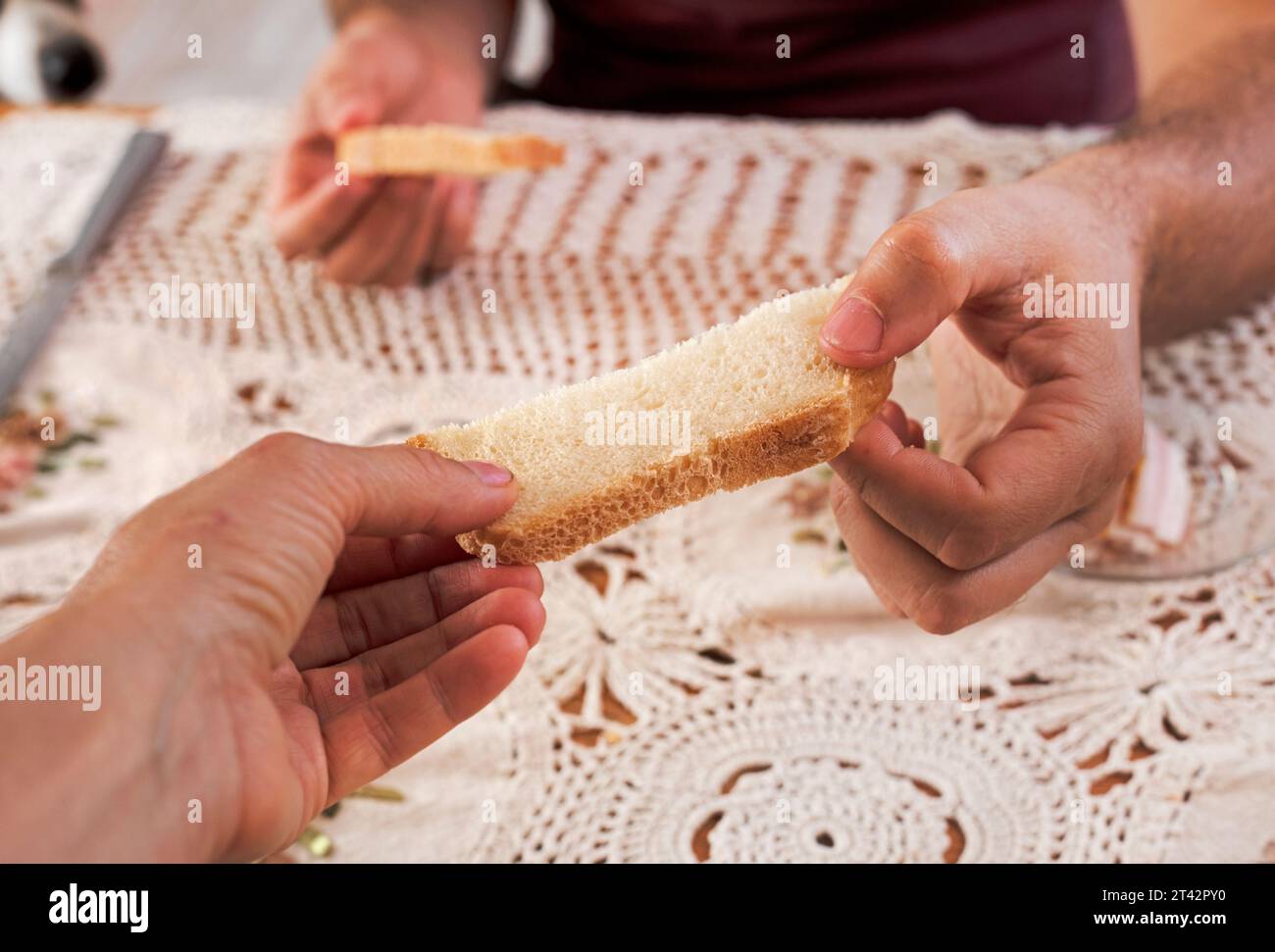 Breaking bread together hi-res stock photography and images - Alamy