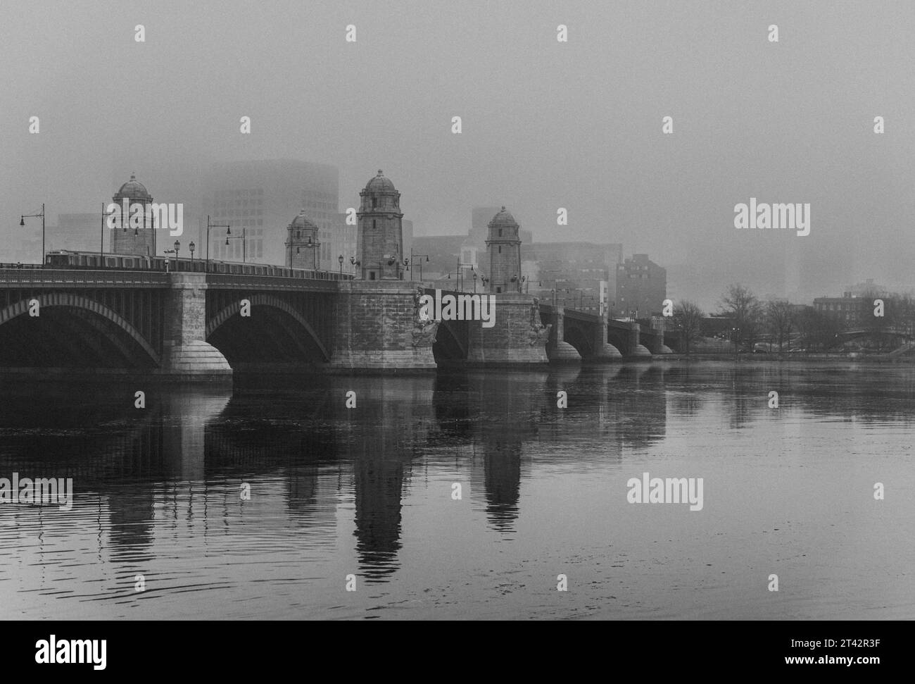 A black and white photograph of a the Longfellow Bridge in Boston over ...