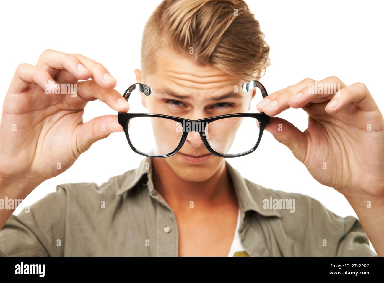 Blind, eyesight and man squint with glasses in studio, white background ...