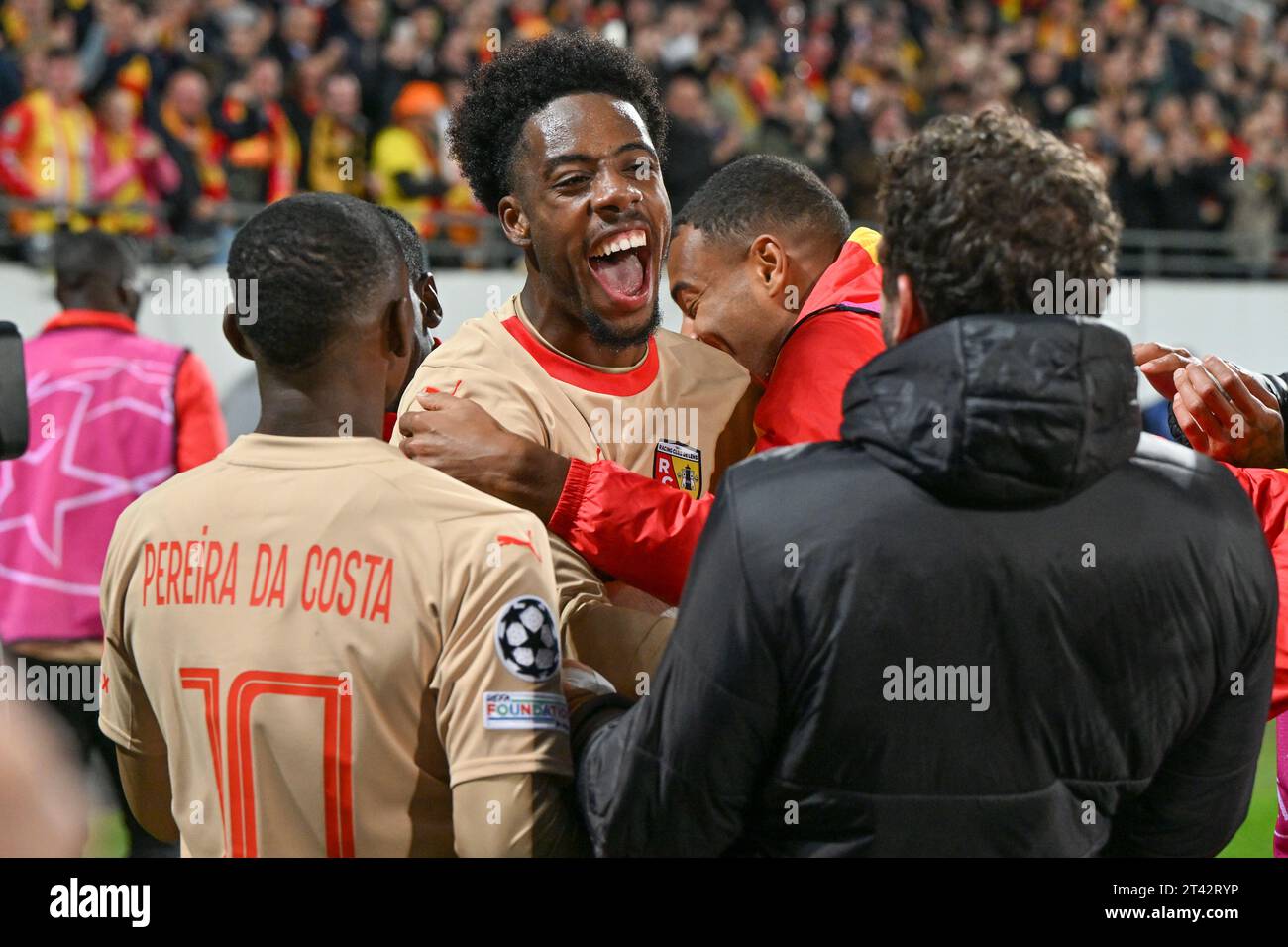 Elye Wahi (9) of RC Lens celebrates with his teammates after scoring ...