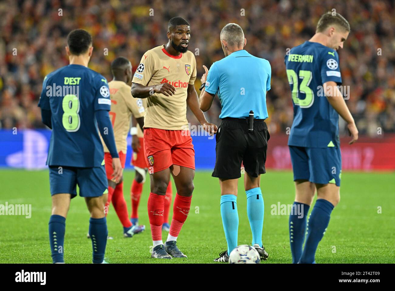Kevin Danso (4) of RC Lens and Roumanian referee Radu Petrescu during ...