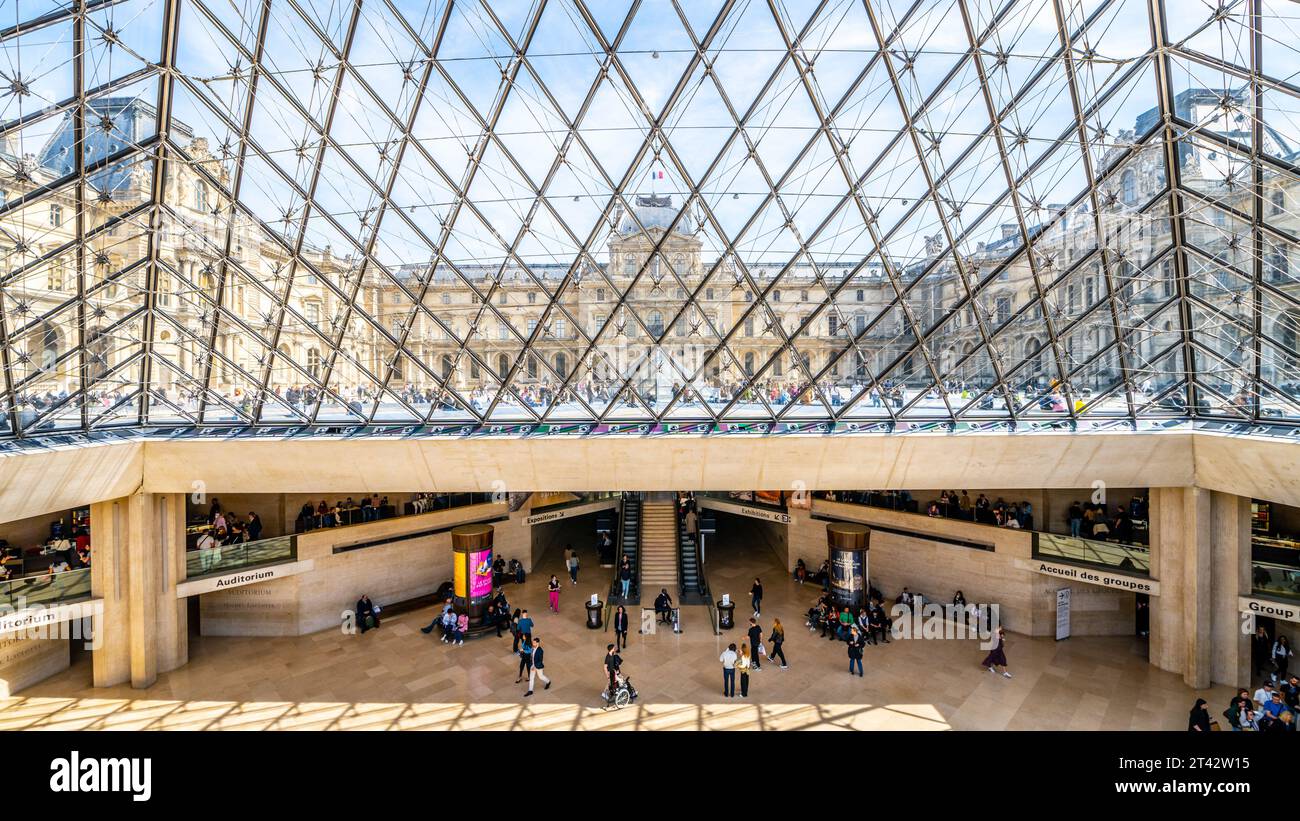PARIS, FRANCE - APRIL 16, 2023: Crowded entrance hall under the glass ...