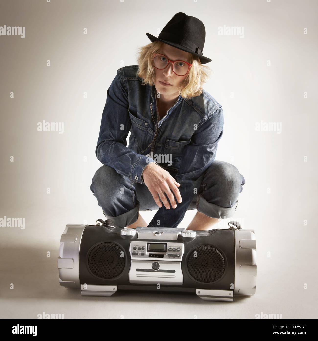 Boombox, fashion and portrait of a man in retro style in studio with ...
