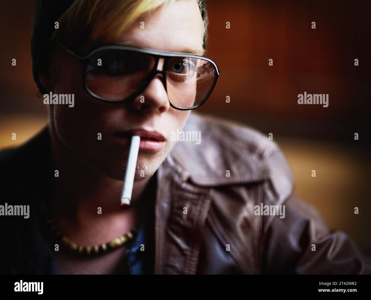 Portrait, addiction and a boy smoking a cigarette closeup for nicotine ...