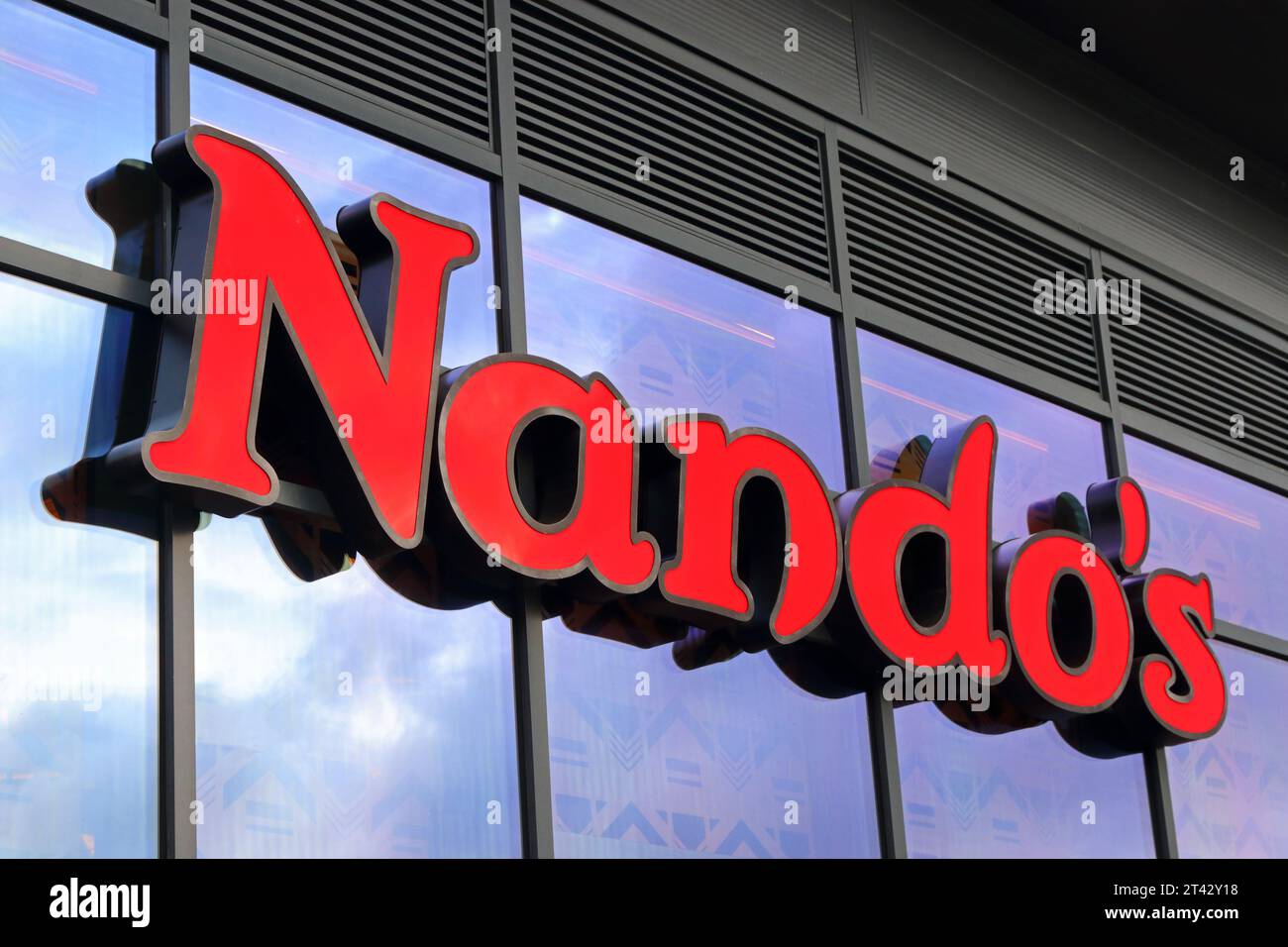 Sign over Nando's restaurant, Burnley Stock Photo - Alamy