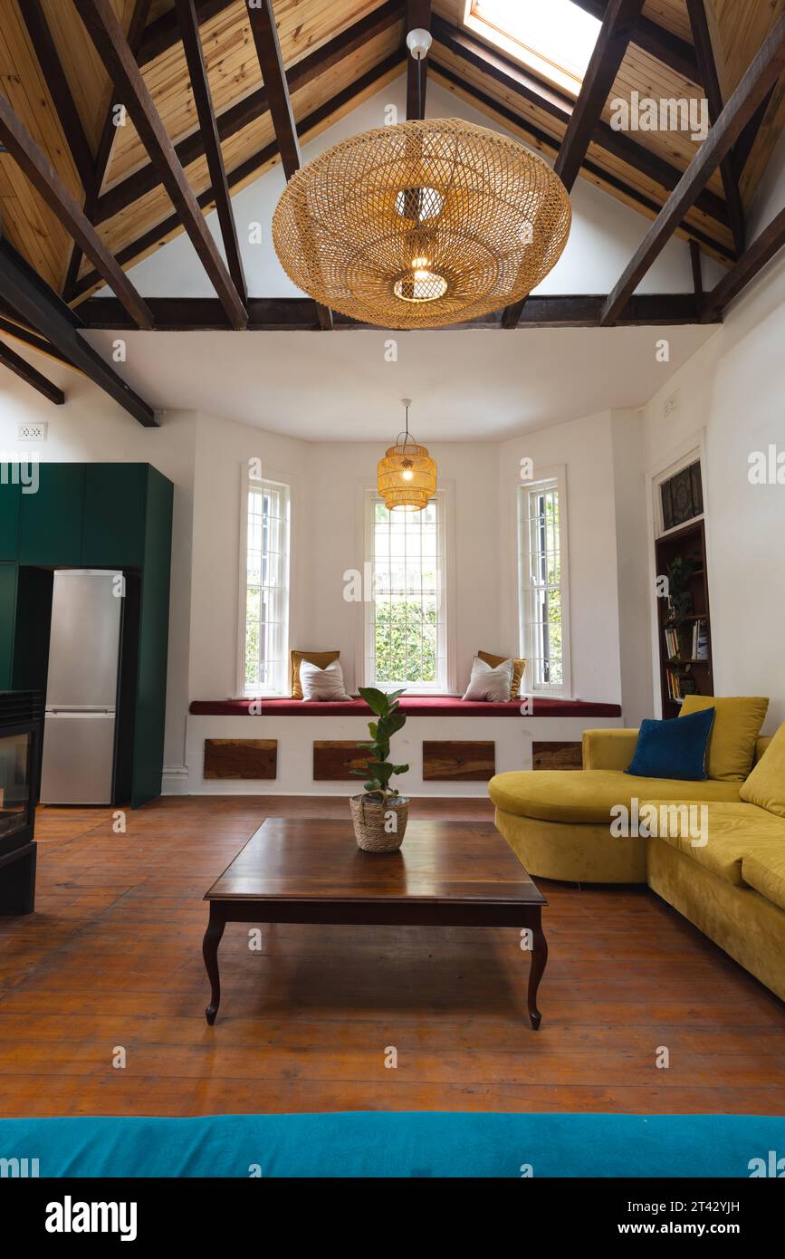 Luxury open plan domestic living room with ceiling open to roof, copy ...