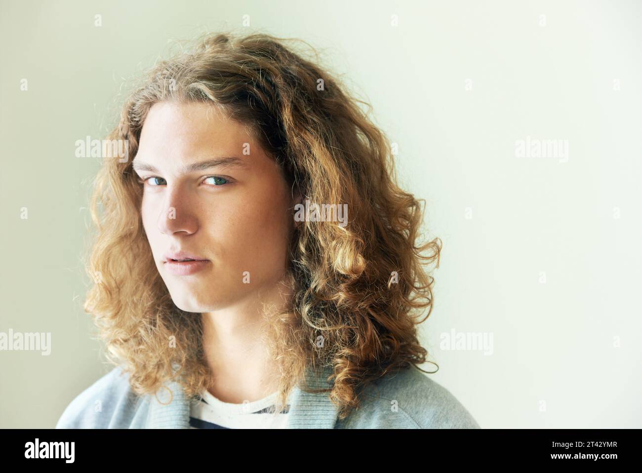 Man, headshot and hair with beauty in portrait, mockup space with curly ...