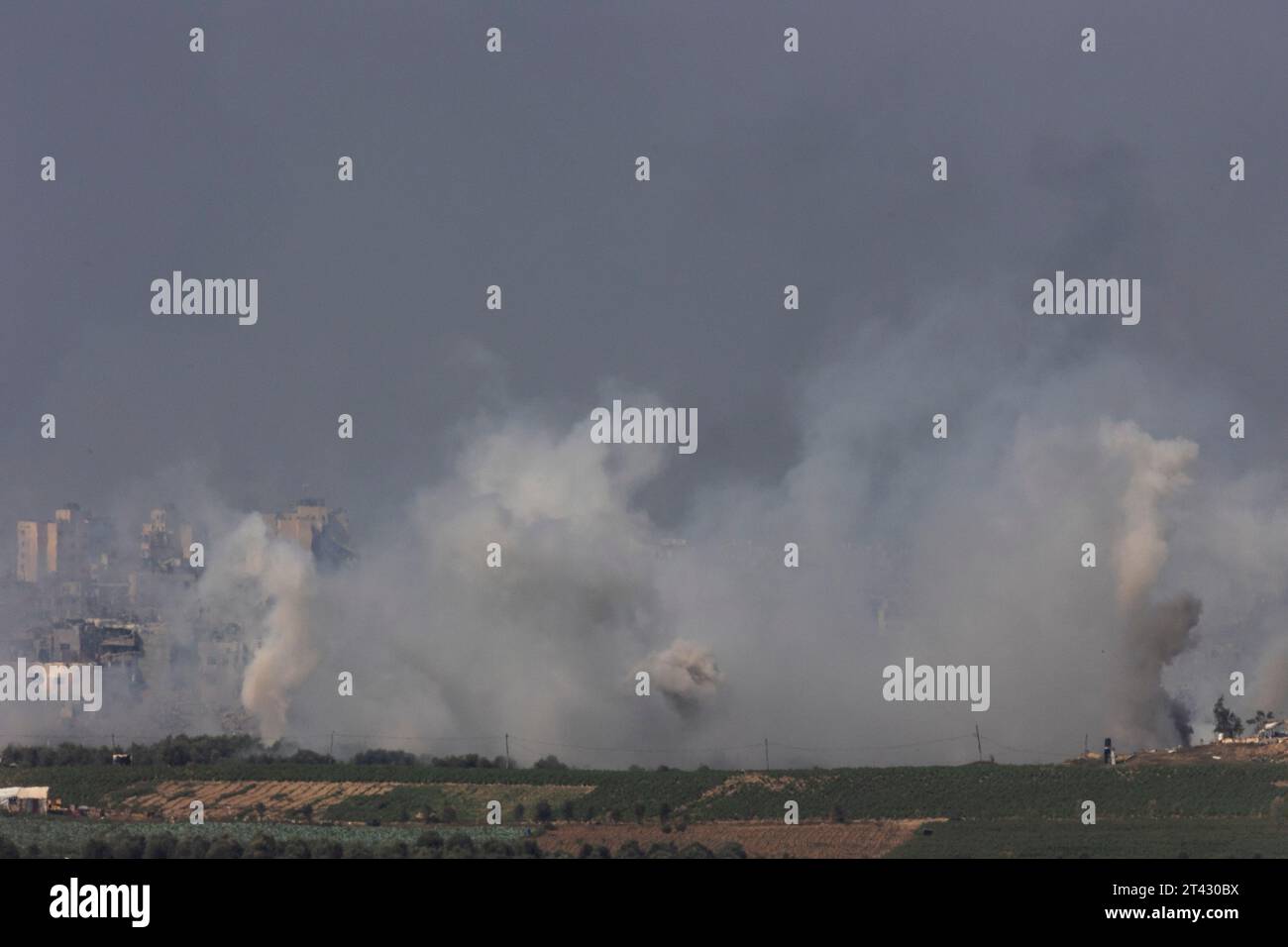 Sderot, Israel. 28th Oct, 2023. An overview of Gaza showing smoke rise from an explosion during ...