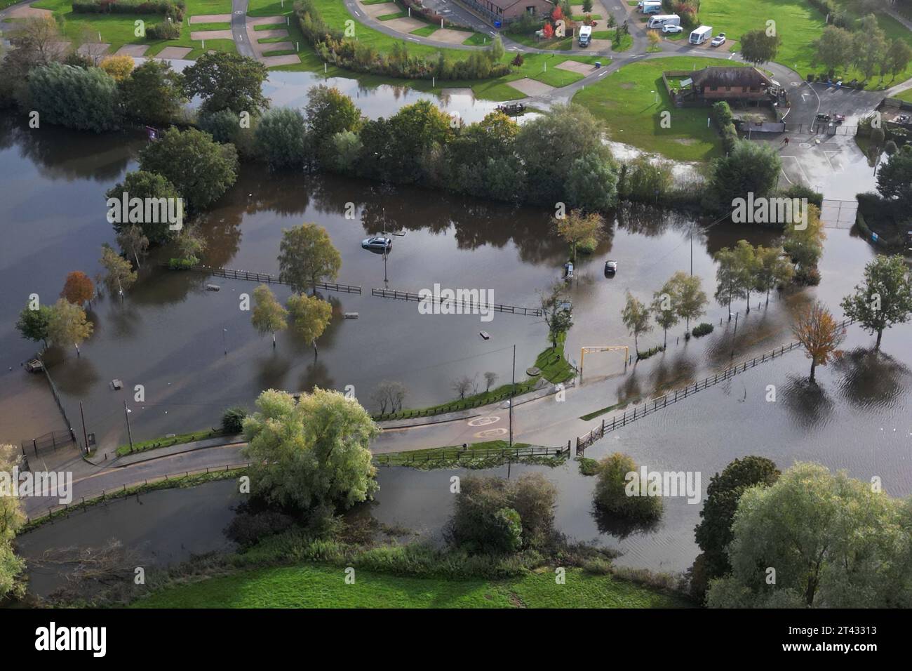 Stranded vehicles can be seen in a flooded car park in Tewkesbury, as ...