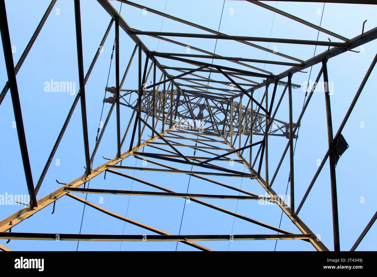 electric tower bottom view in the blue sky, steel power transmission ...