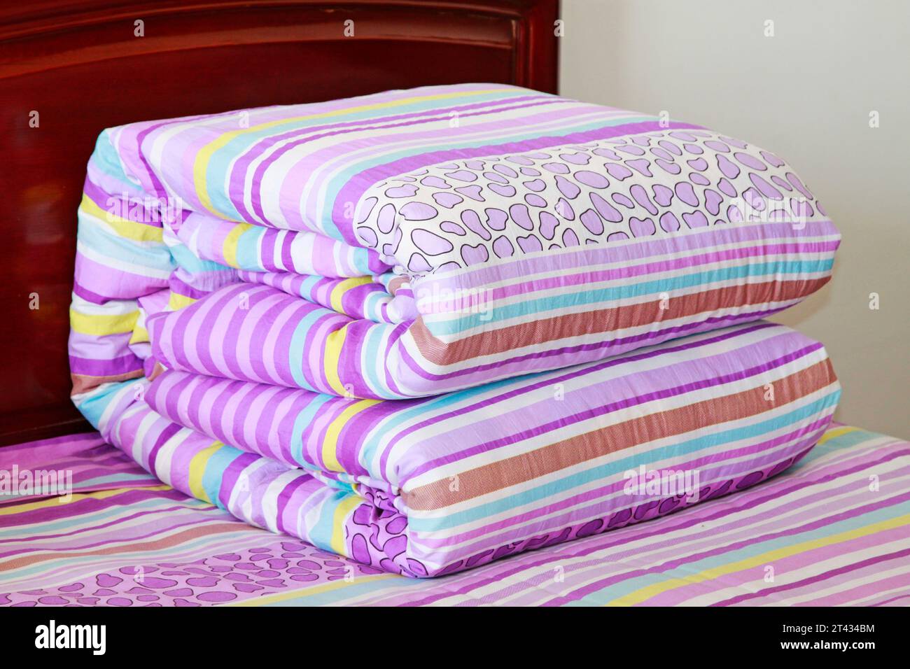 fold the quilt on the bed, closeup of photo Stock Photo - Alamy