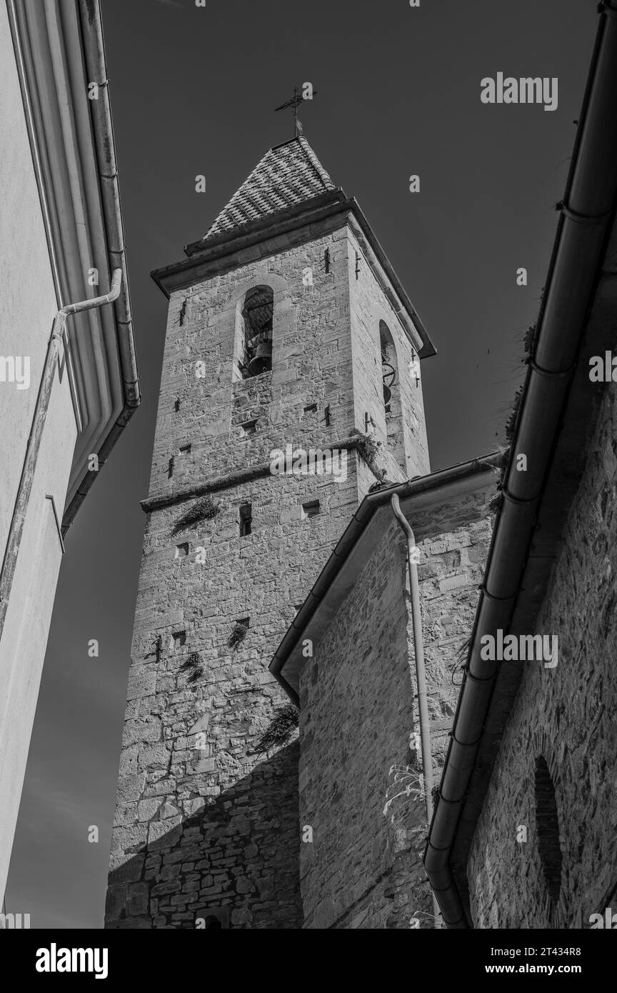 The façade is simple, in stone ashlars, with a portal decorated with a ...