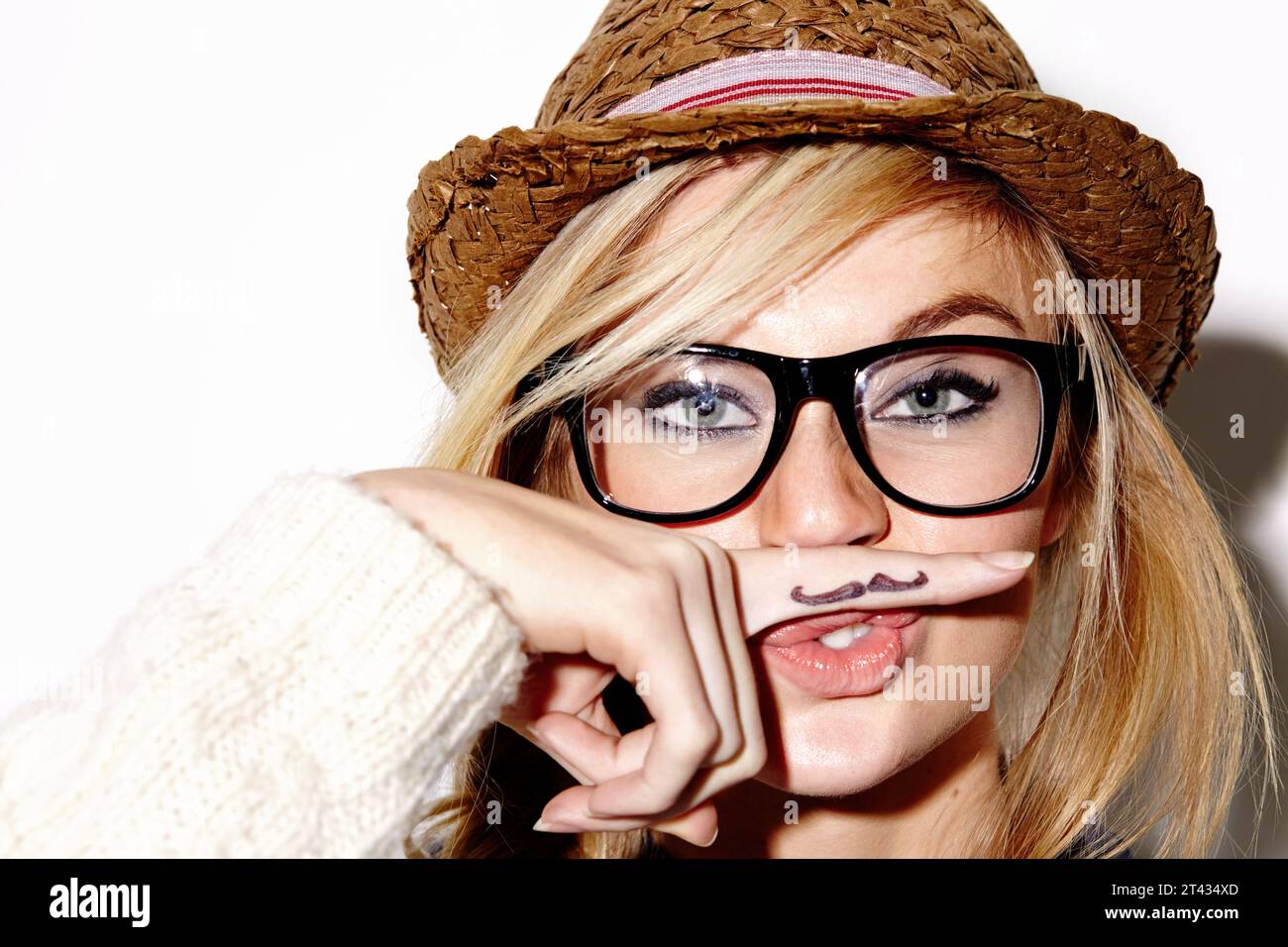 Portrait, party and finger mustache with a woman in studio isolated on ...