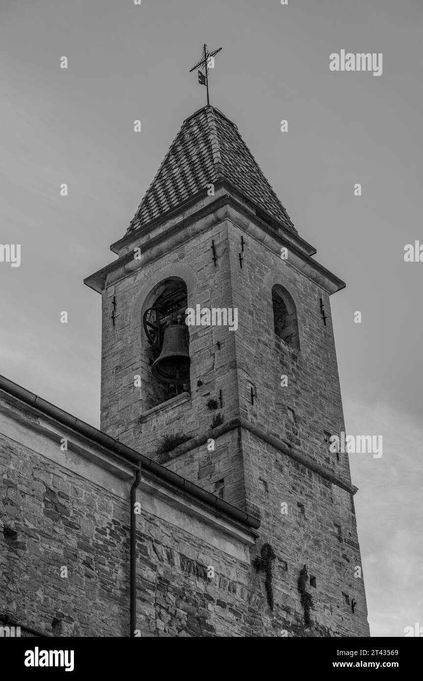 The façade is simple, in stone ashlars, with a portal decorated with a ...