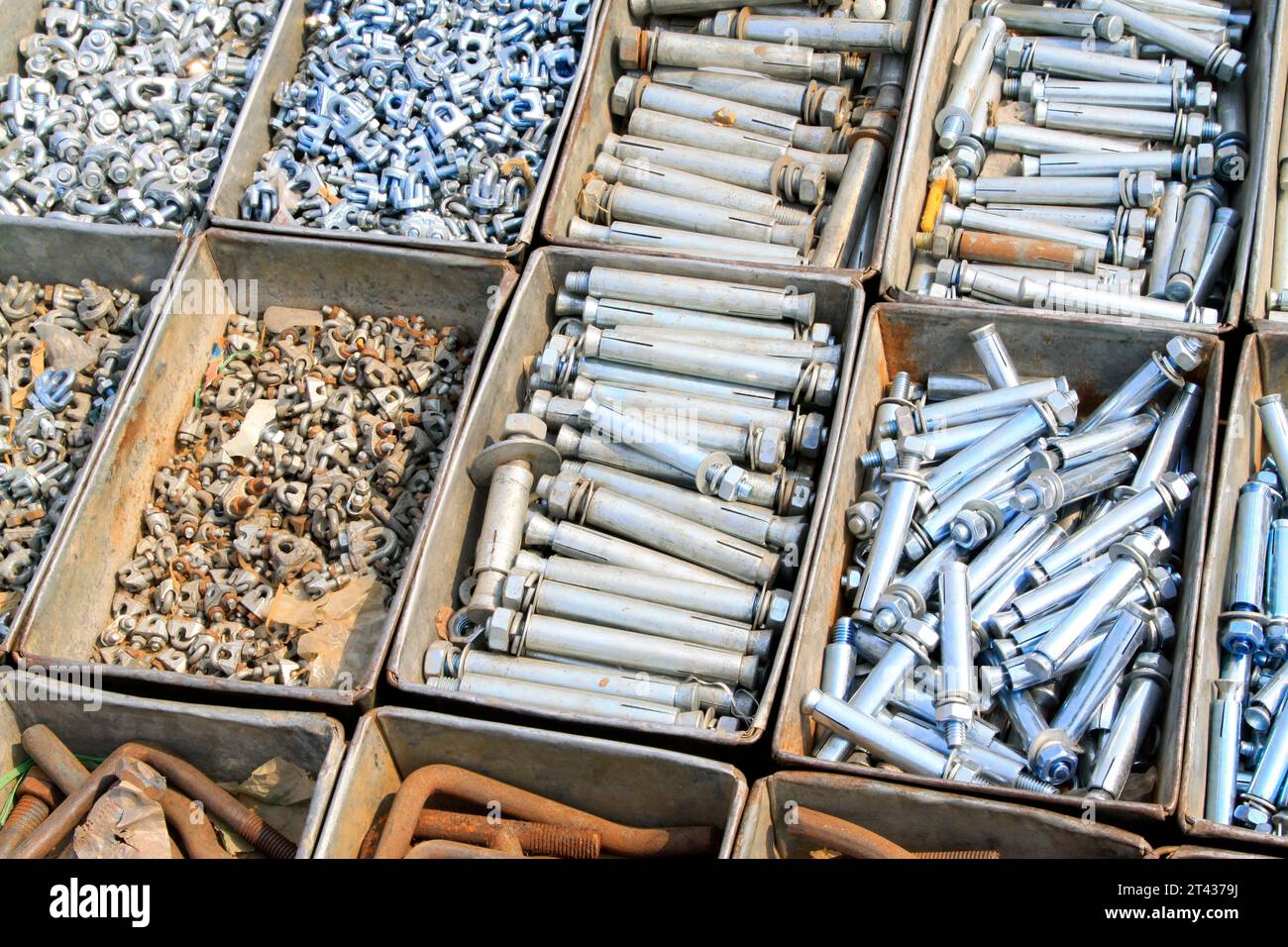 metal parts and fasteners in a iron box, closeup of photo Stock Photo ...